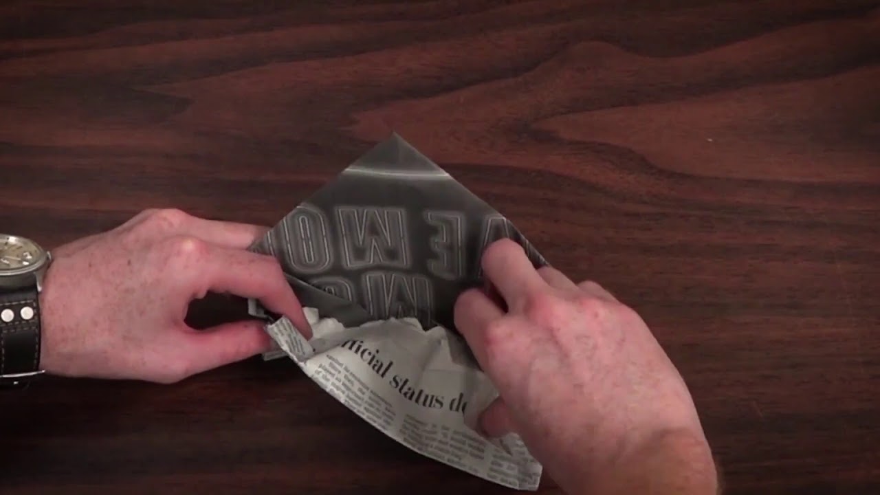 How to Fold a Newspaper Container for Plants - YouTube