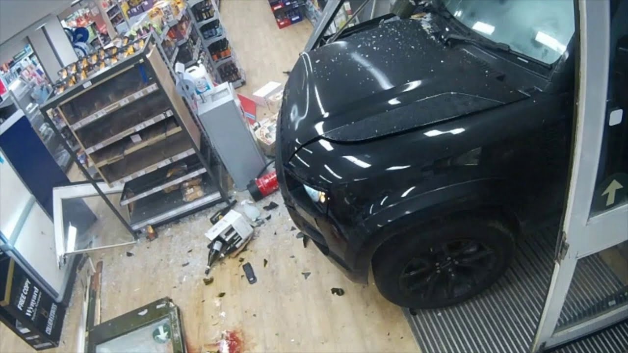 Former Premier League footballer crashes car through shop front - YouTube