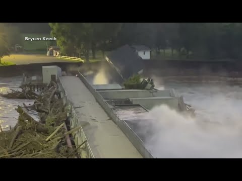 Dam partially fails in Minnesota, house falls into river - YouTube