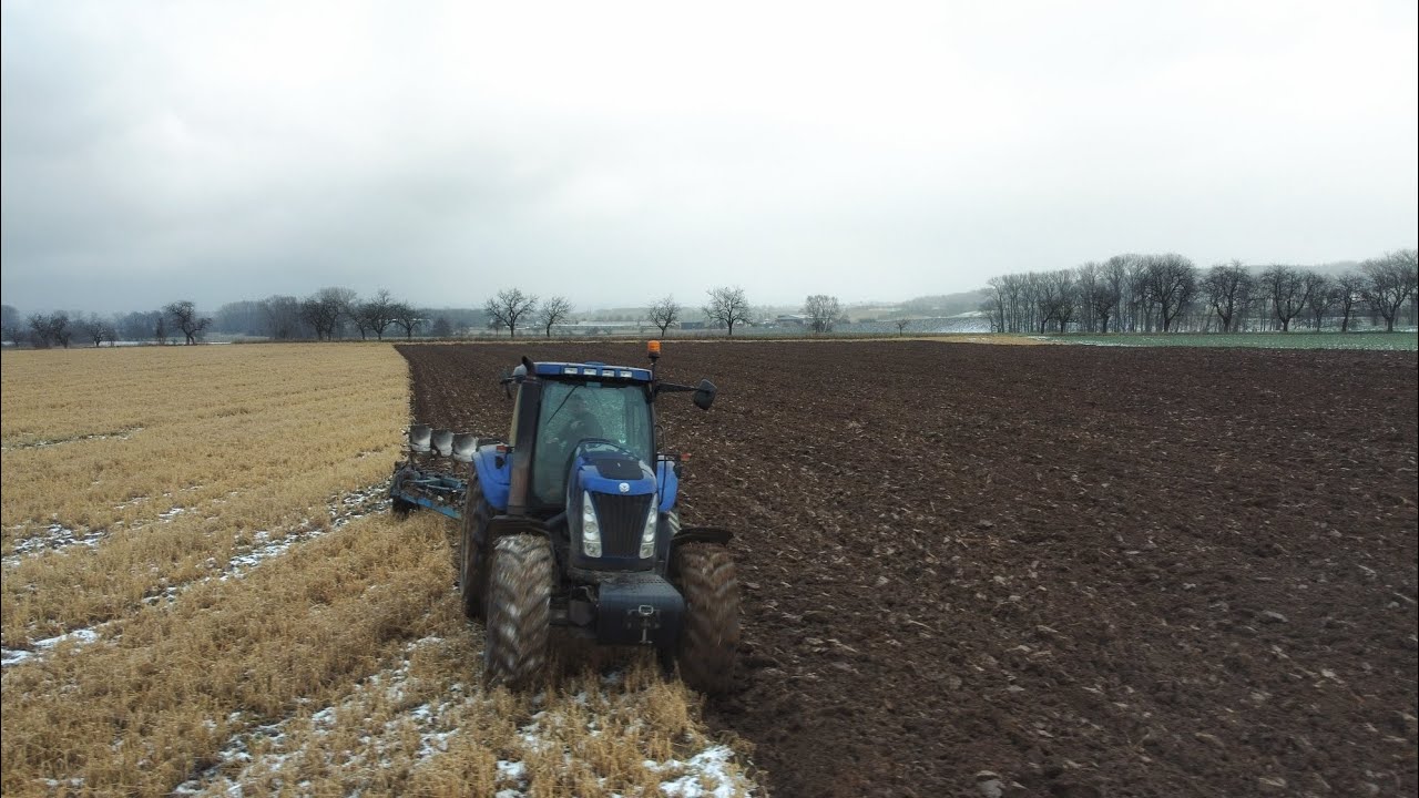 Winter ploughing with New Holland tg255 - YouTube