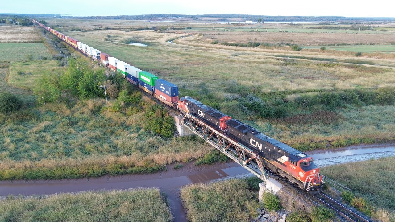 Awesome Aerial 4K View! Long Extra Stack Train CN X121 passing Nappan ...
