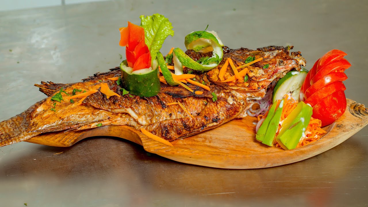 COOKING// HOW TO GRILL A WHALE TILAPIA AT HOME LIKE IN A HOTEL. - YouTube