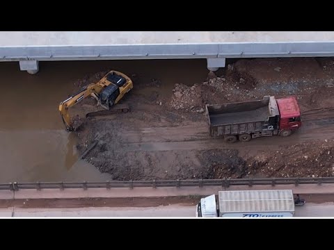 SANY Excavator And SCANIA Dig the ground under the bridge to prevent ...