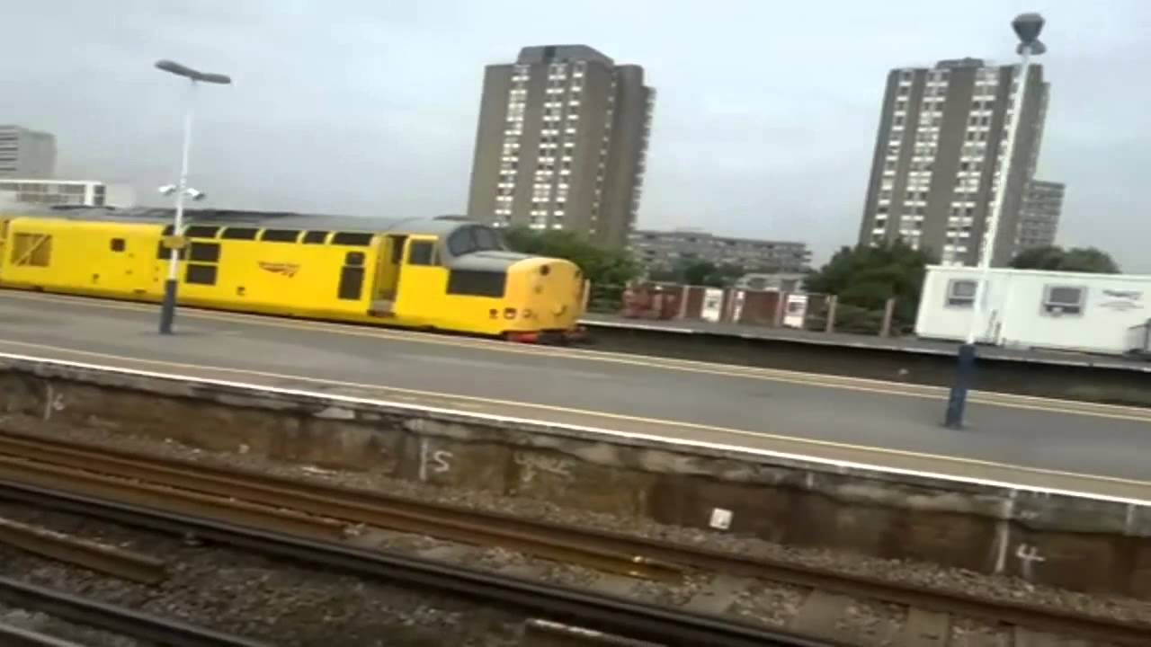 Network Rail Class 37 departing Clapham Junction station - YouTube