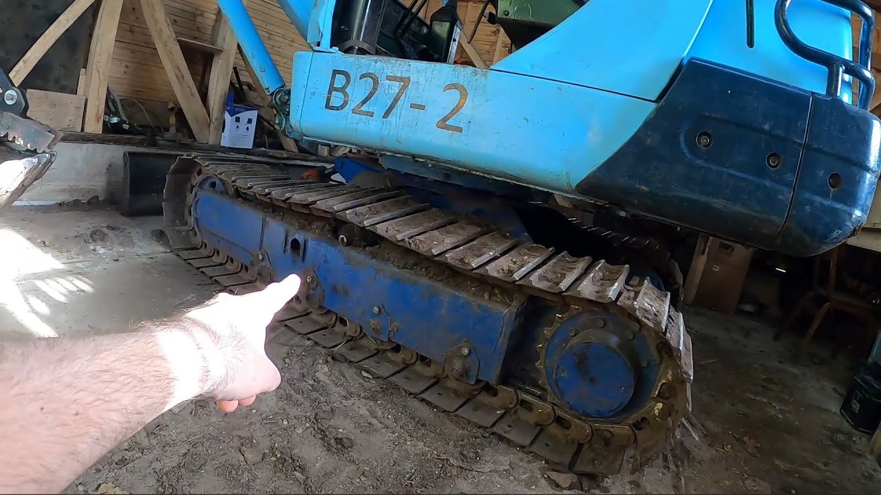 Fixing track roller on Yanmar excavator - YouTube