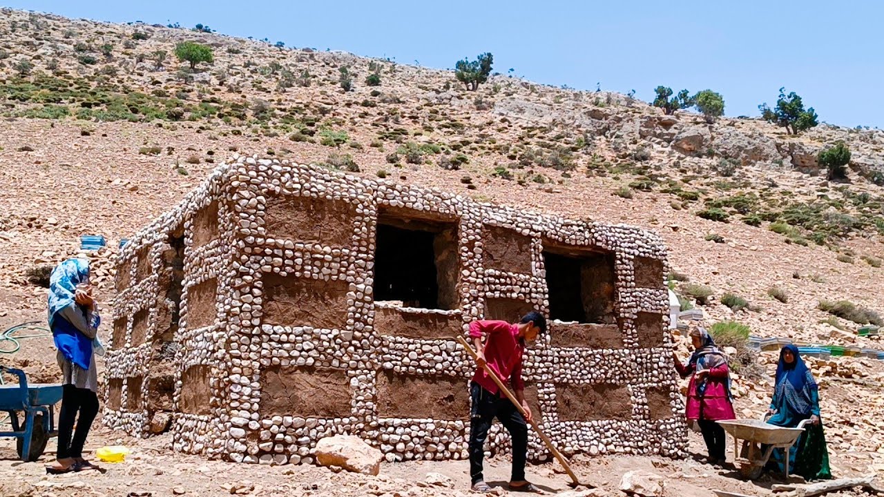 The process of building a beautiful winter stone hut in the mountains ...