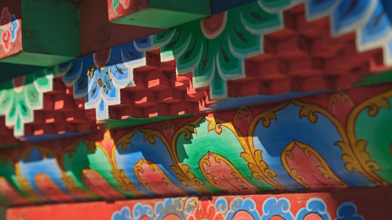 Close up of traditional colorful religious designs on a Nepalese temple ...