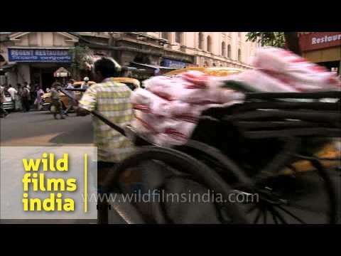 Human-pulled rickshaw on streets of Kolkata - YouTube