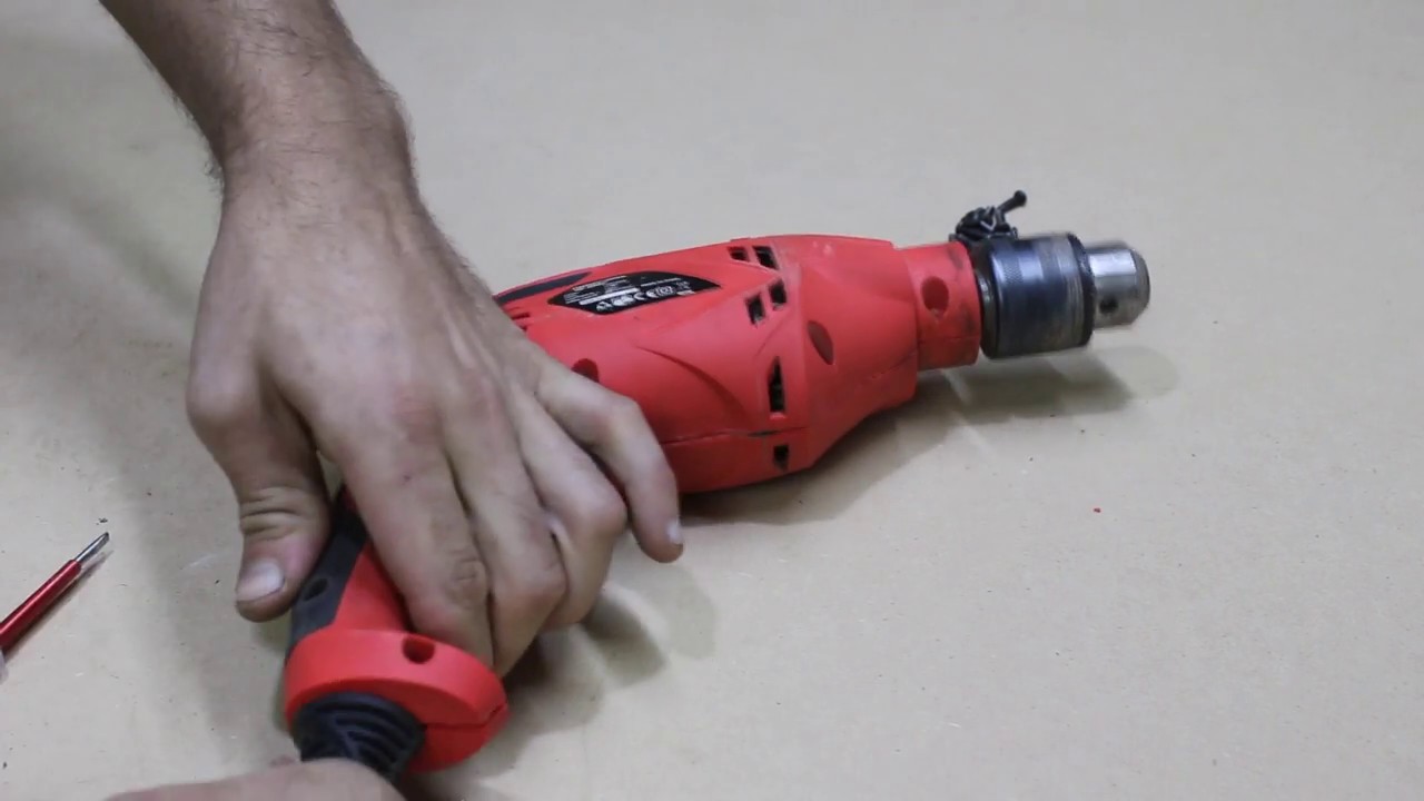 Power tool repair power drill - connecting the cable to the switch ...