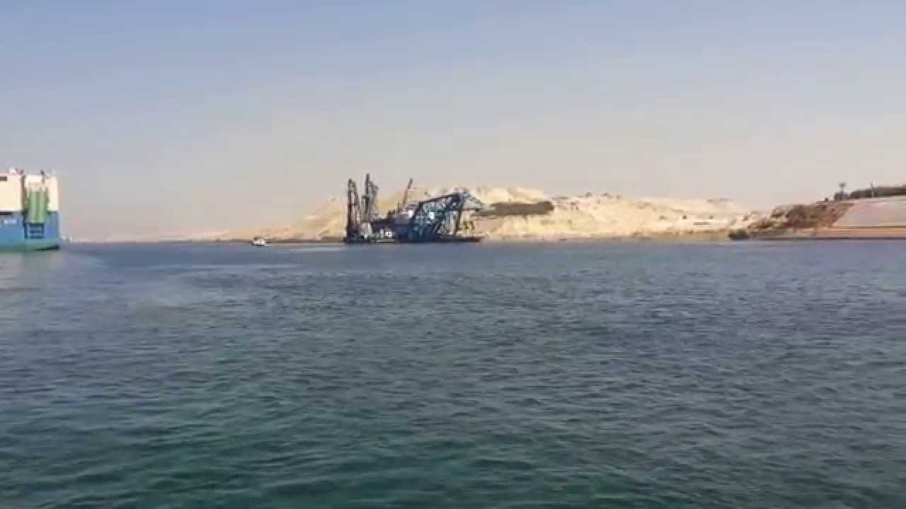 New Suez Canal: a scene in drilling and dredging and navigation through ...