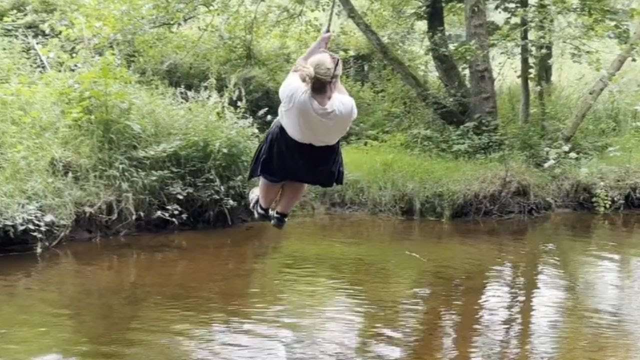 Woman fails to cap off rope swing fun with proper landing, resulting in ...