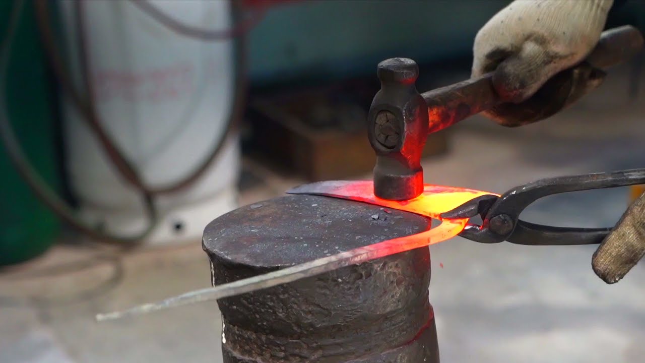 Process of Making traditional tools in a blacksmith's shop ...