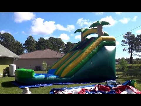 Unbox the palm tree waterslide. USA flag bounce house Jamaican vibes. Ride to the beach and ...
