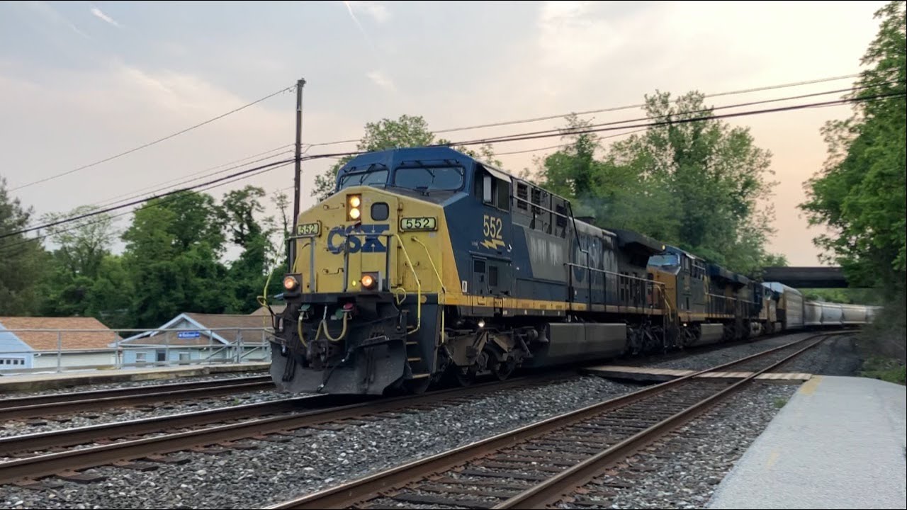 CSX YN2 leads M214 in the sunset - YouTube