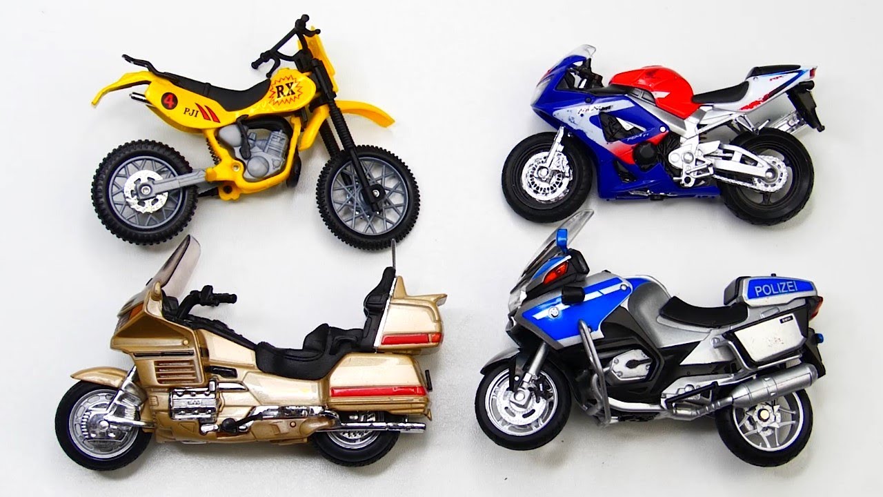 Small Motorcycles Being Reviewed in Hands - YouTube
