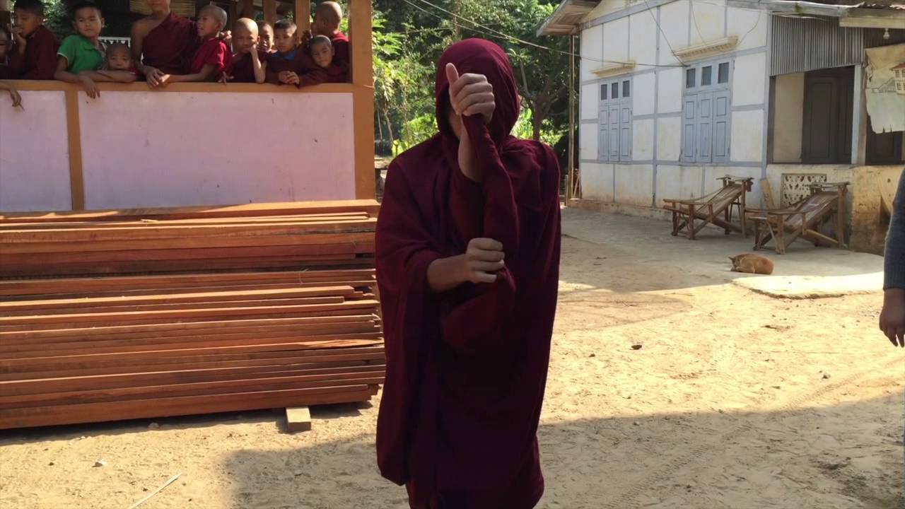 Monk Wrapping His Robe for Alms Collecting in Myanmar | SmarterTravel ...