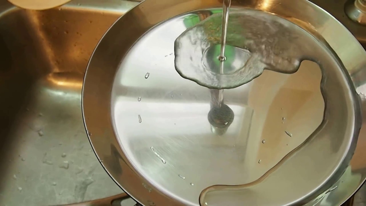 Water draining off polished pan - YouTube