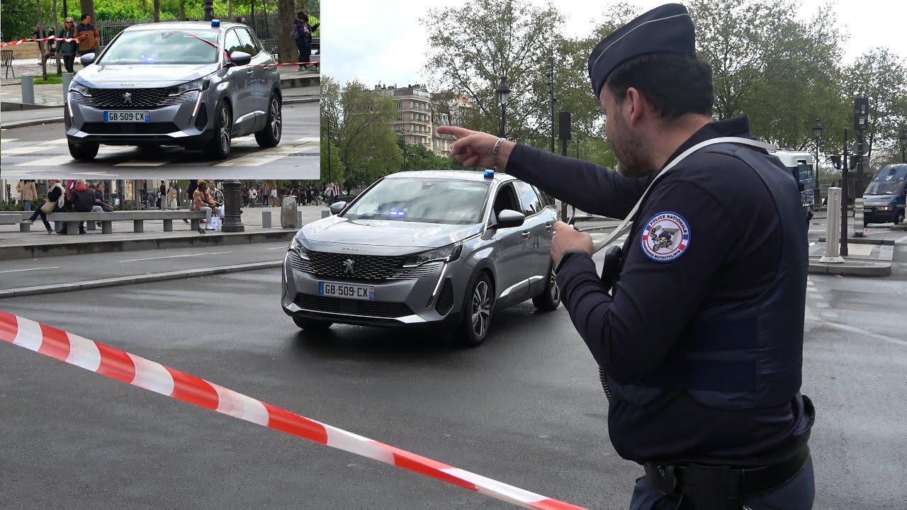 Police convoy drive through police line and discuss with colleague in ...
