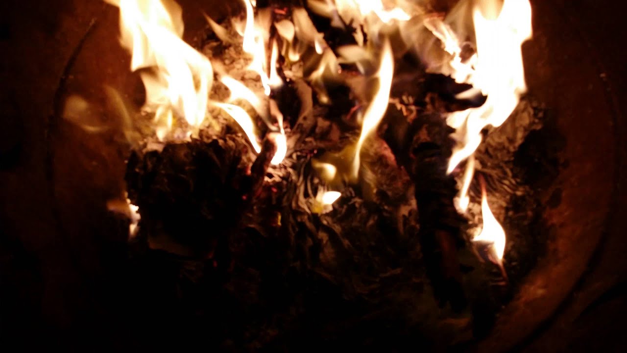 Wood & Junk Mail in a Fire Pit from above - YouTube