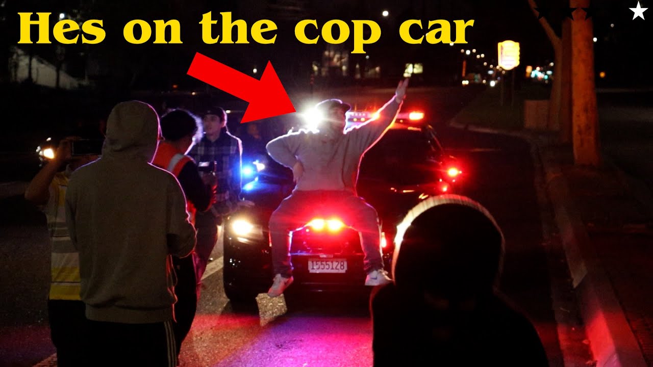 GUY SITS ON TOP OF THE COP CAR!! BLOCKERS FTW! - YouTube