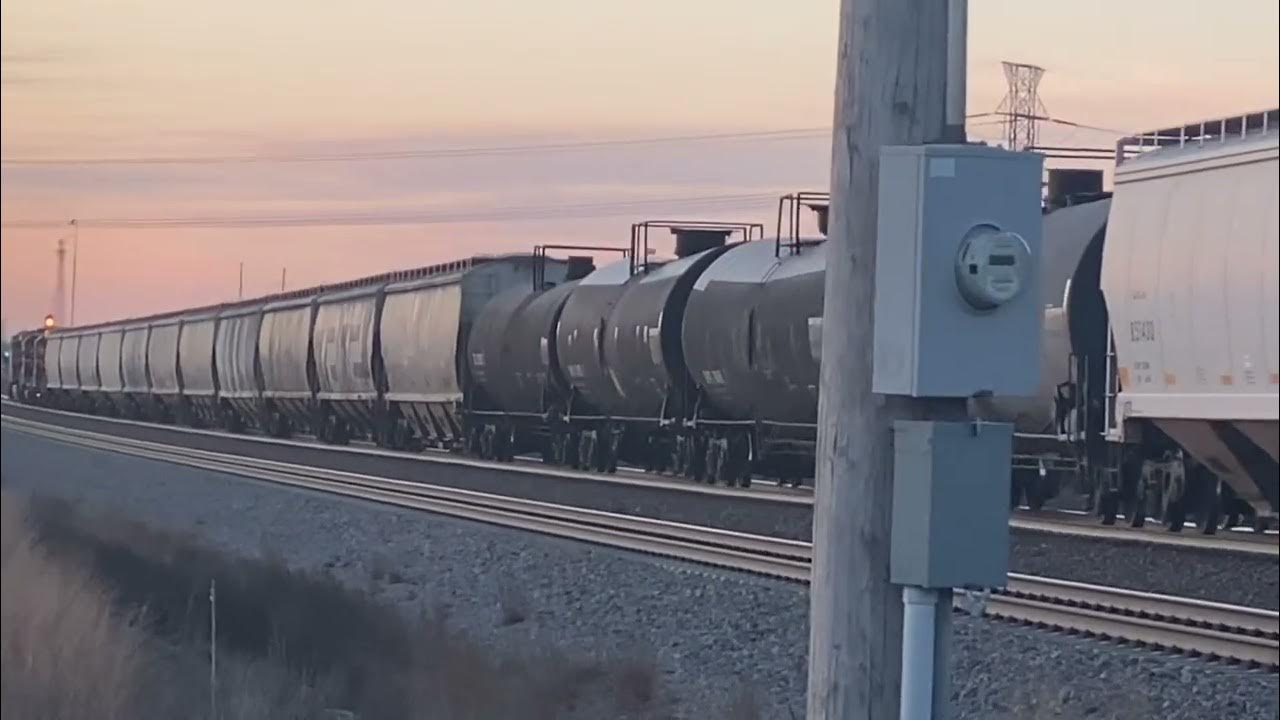 BNSF westbound manifest train with a horn show a GP38-2 another Geep and an ATSF warbonnet ...