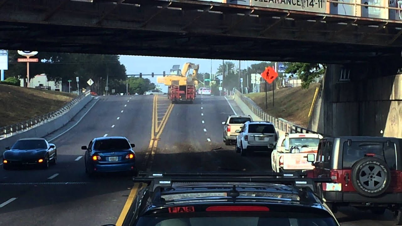 Truck hits bridge with excavator - YouTube