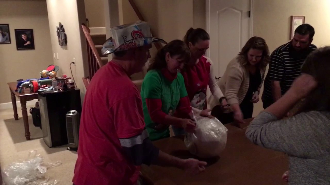 Best and biggest Christmas saran wrap prize ball party game! - YouTube