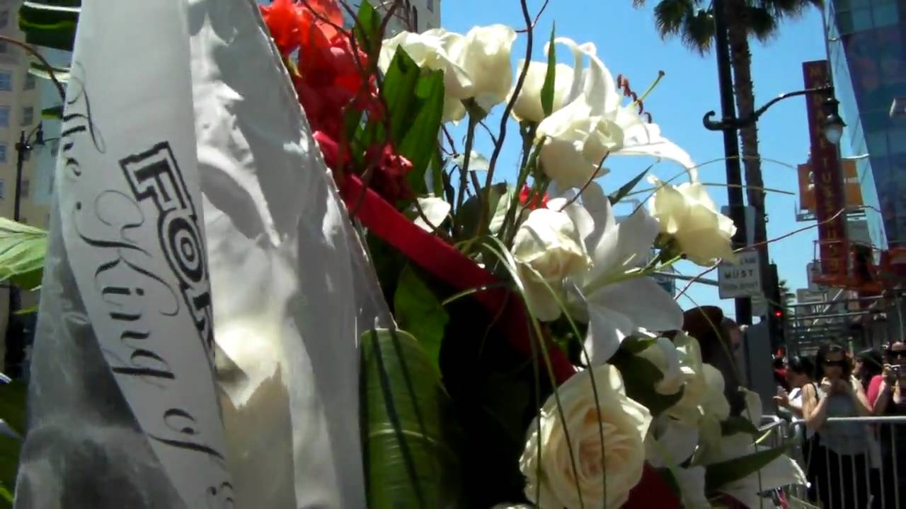 Michael Jackson...fans place beautiful flower bouquets @ Pop Icon's ...