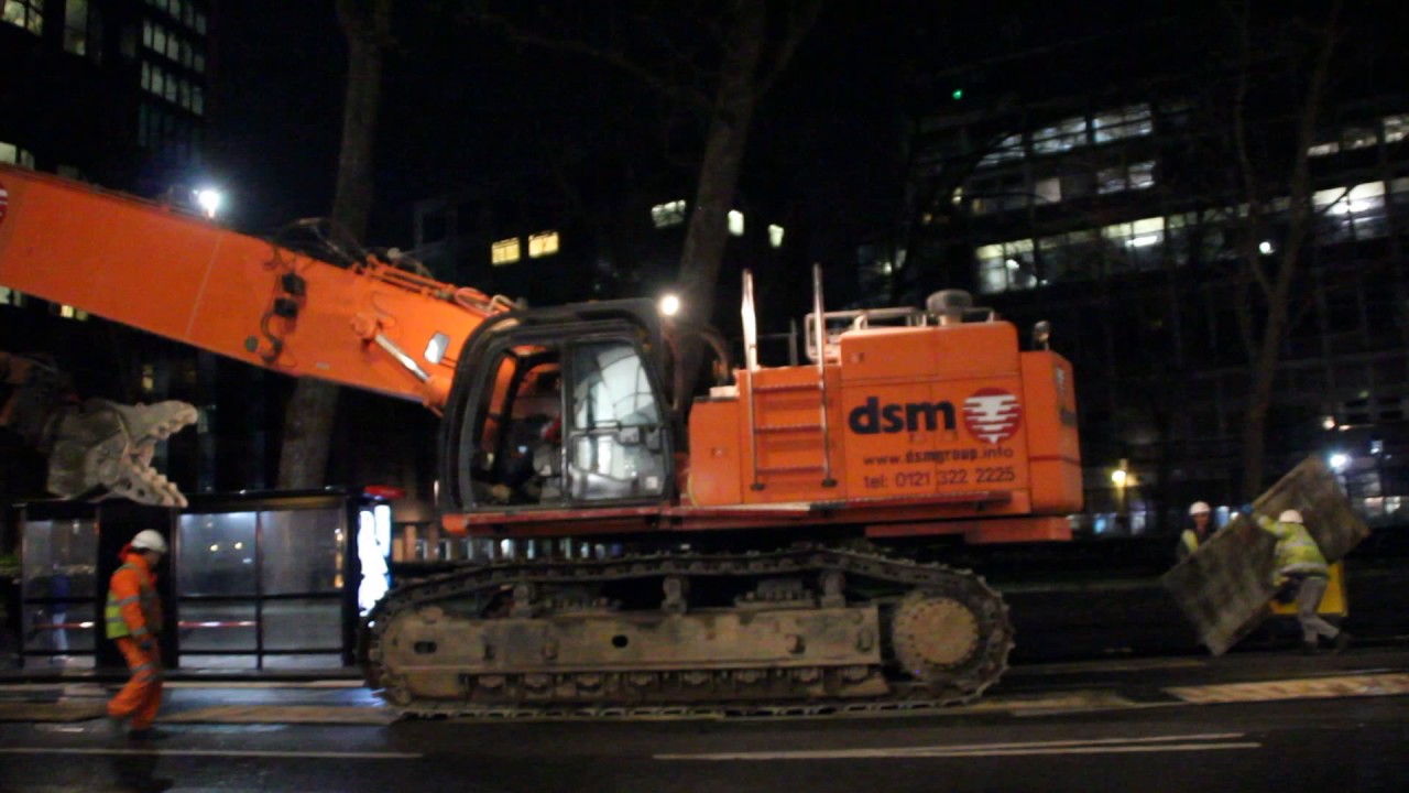 DSM Demolition Hitachi 670LCH long-reach machine moving from site - YouTube