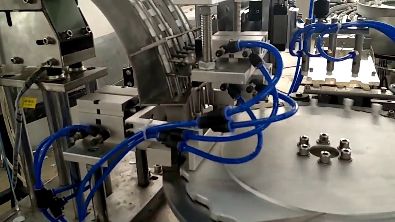 Automatic spout capping machine - YouTube