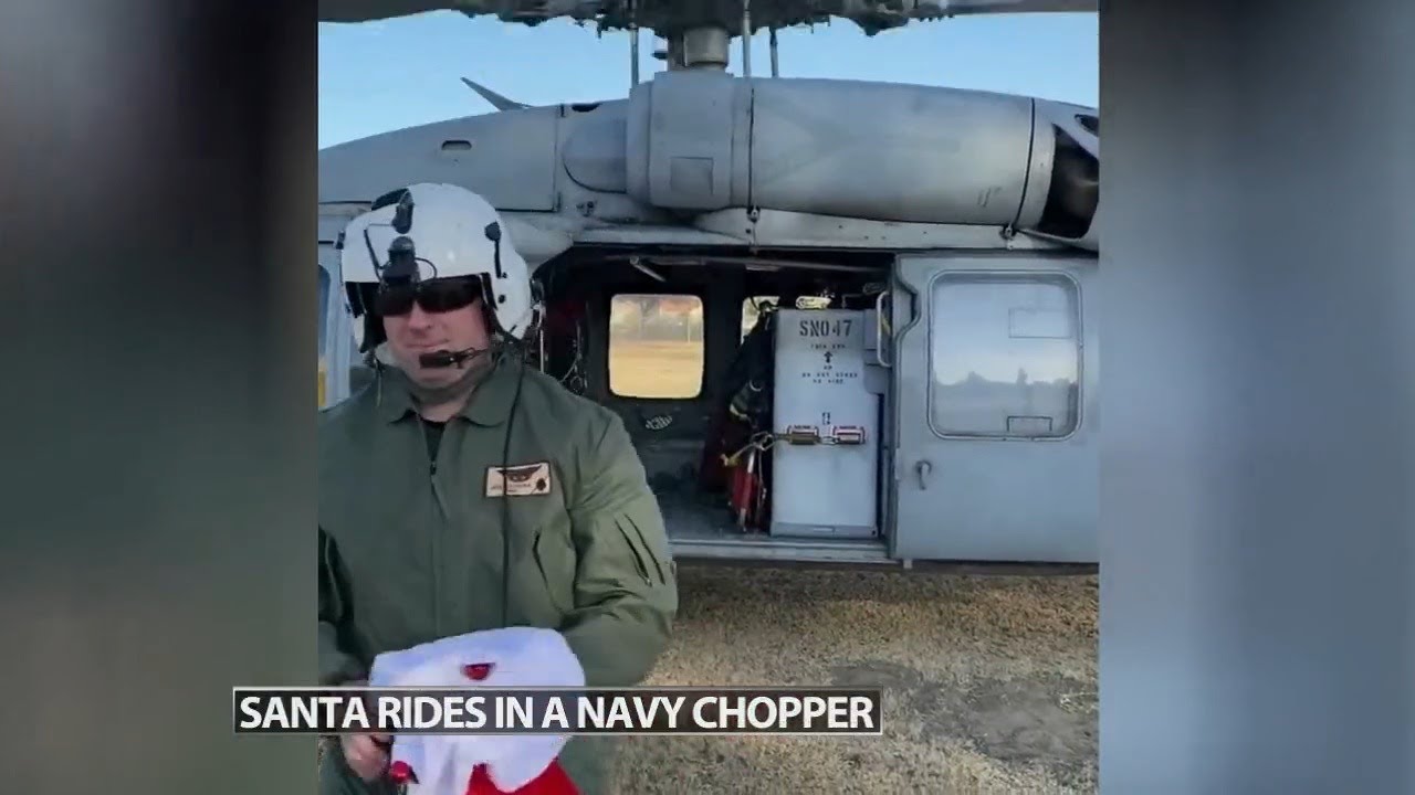 Santa rides in Navy chopper - YouTube