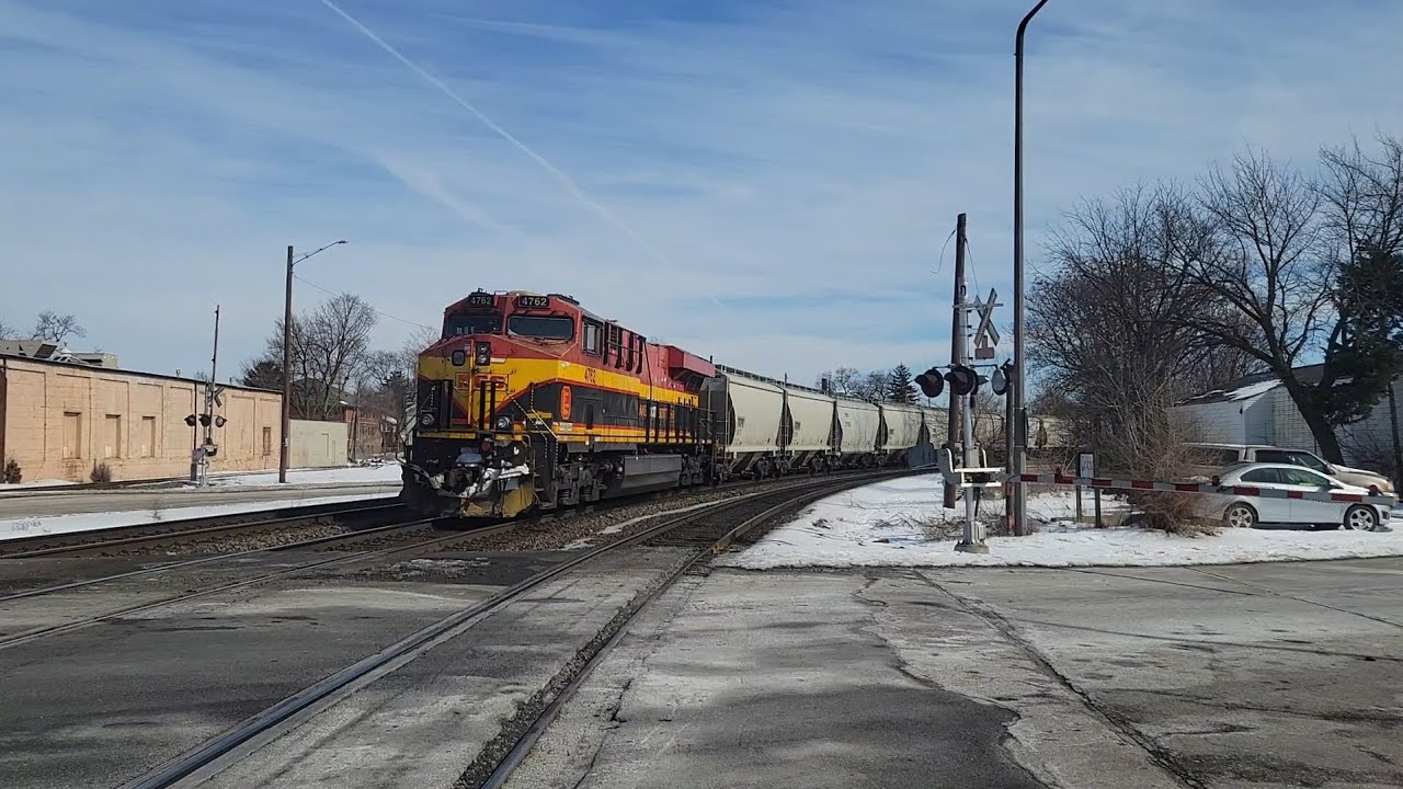 an eastbound hopper train passing Elkhart station shot from Main st ...