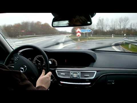 Mercedes S350 BlueTec driven through town in the rain