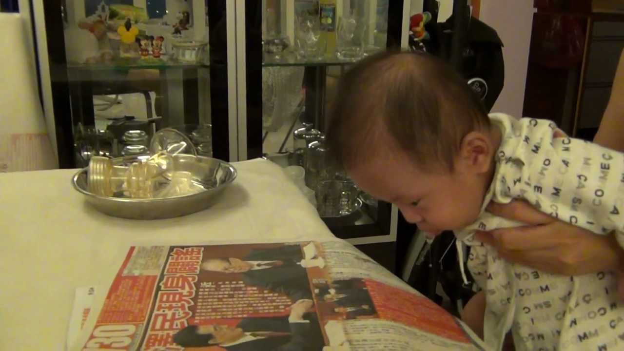Baby Reading Newspaper and Drooling - YouTube