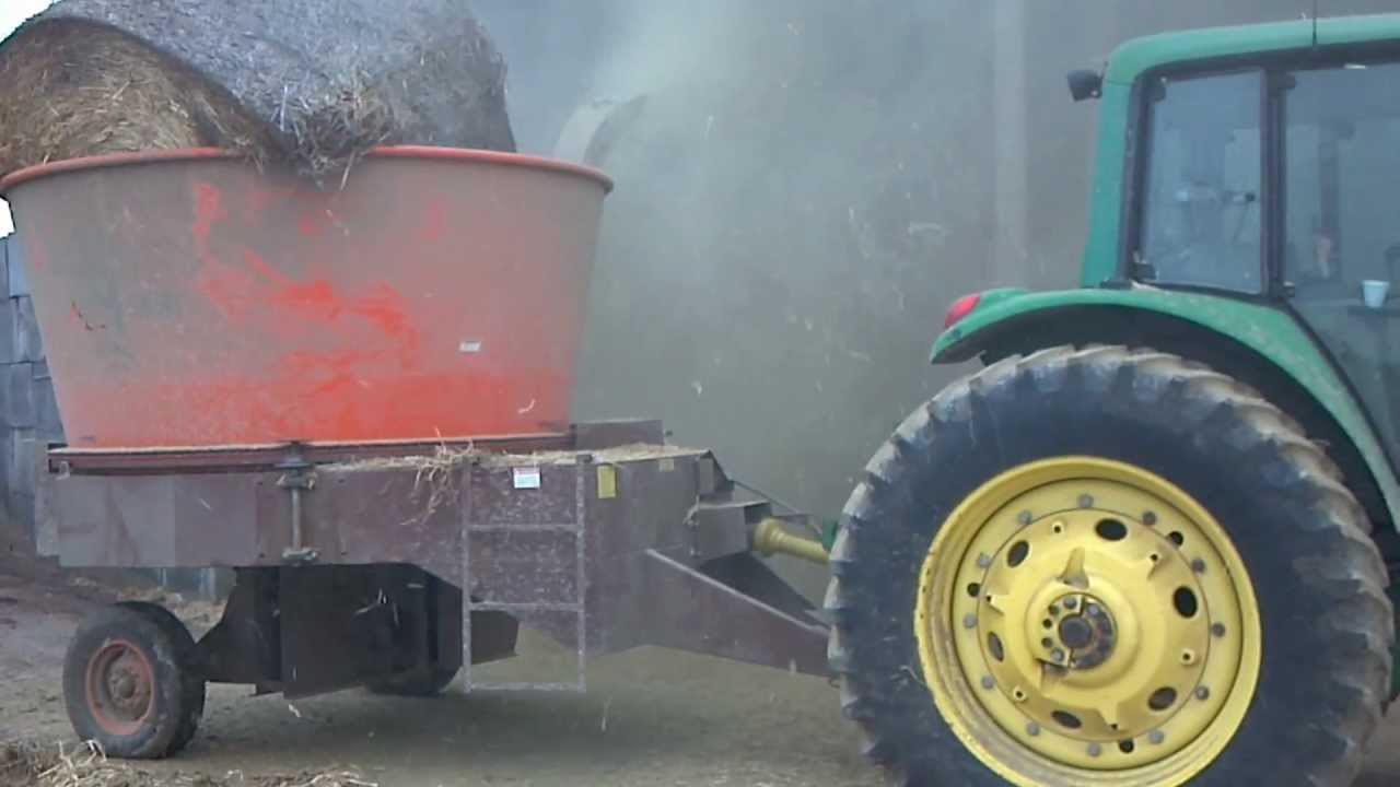 Grinding hay - YouTube