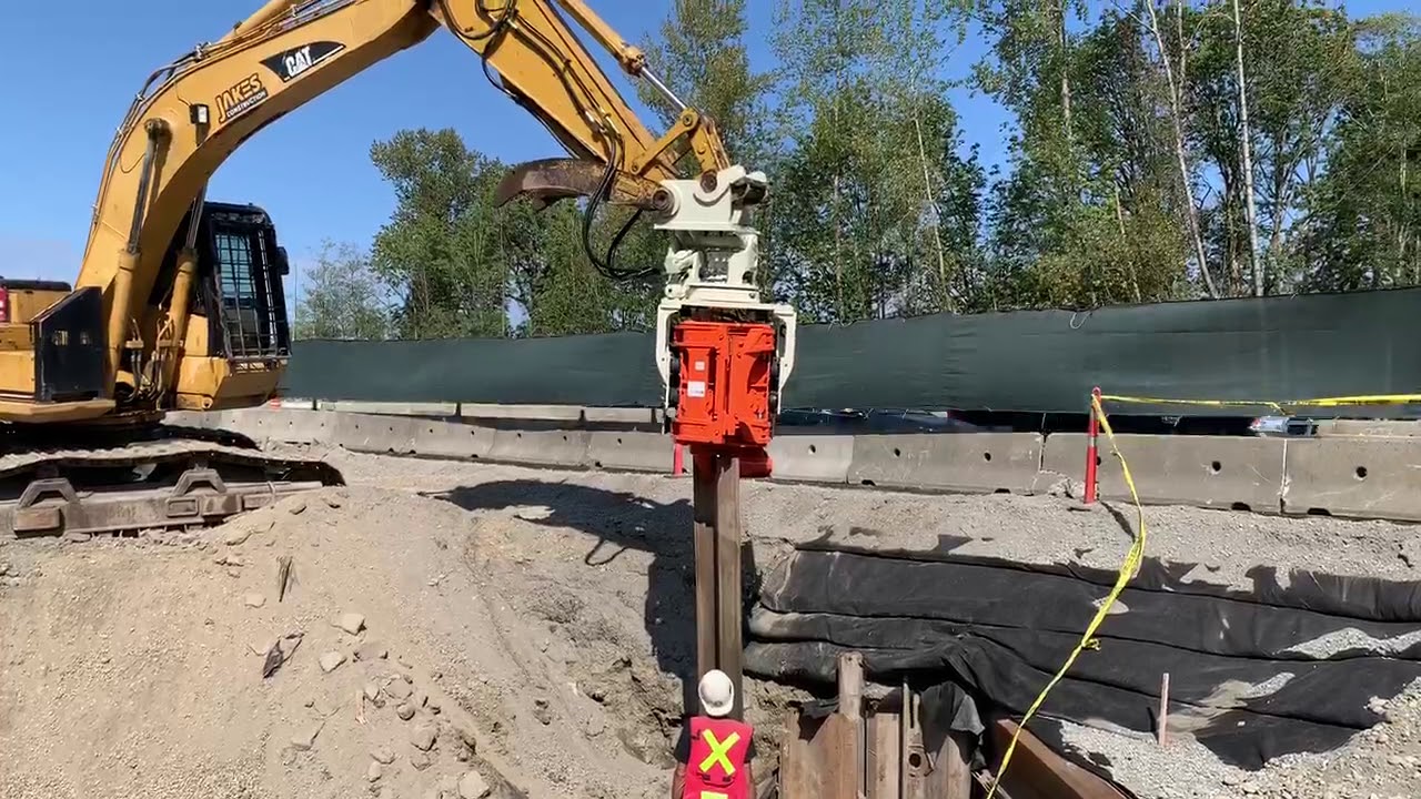Driving sheet piling for huge highway project with MG-90 side-grip pile ...