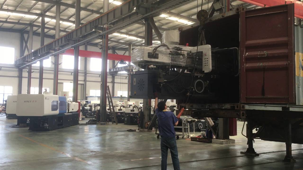 loading machine .plastic injection molding machine - YouTube