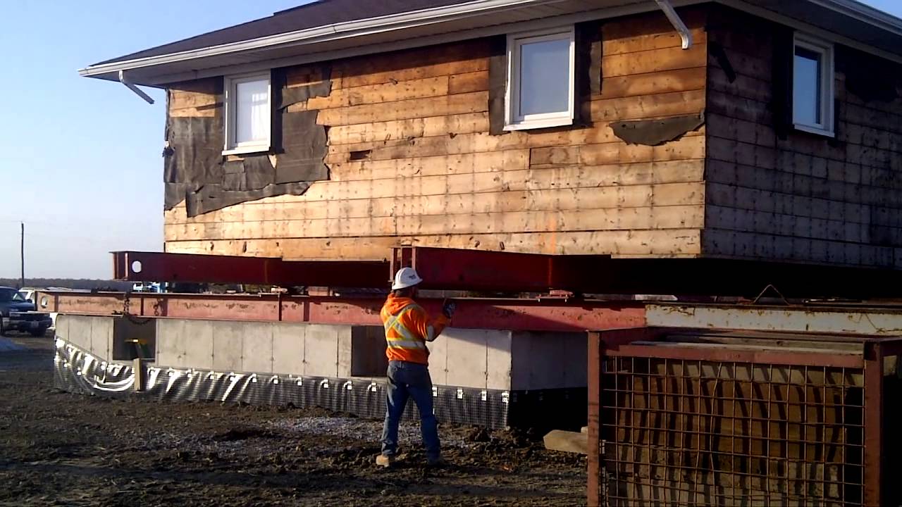 rolling a house onto a foundation - YouTube