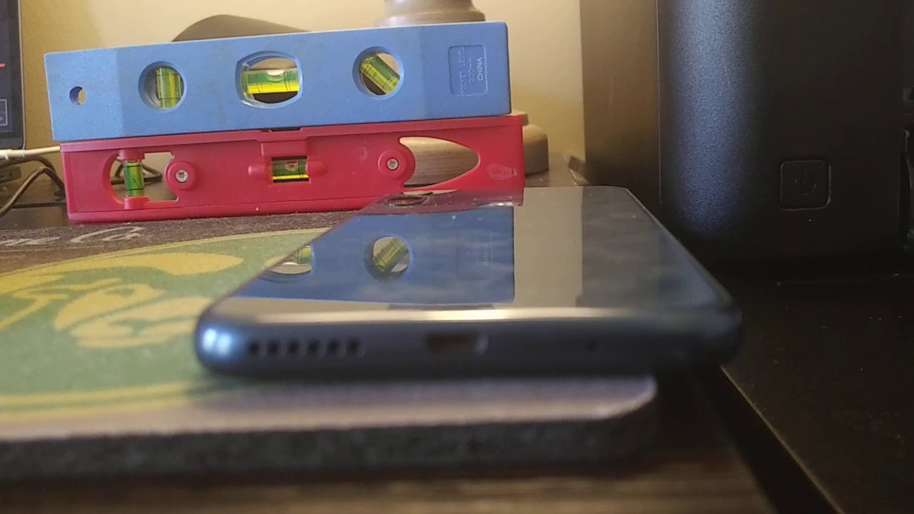 Phone falls off desk all by itself - YouTube