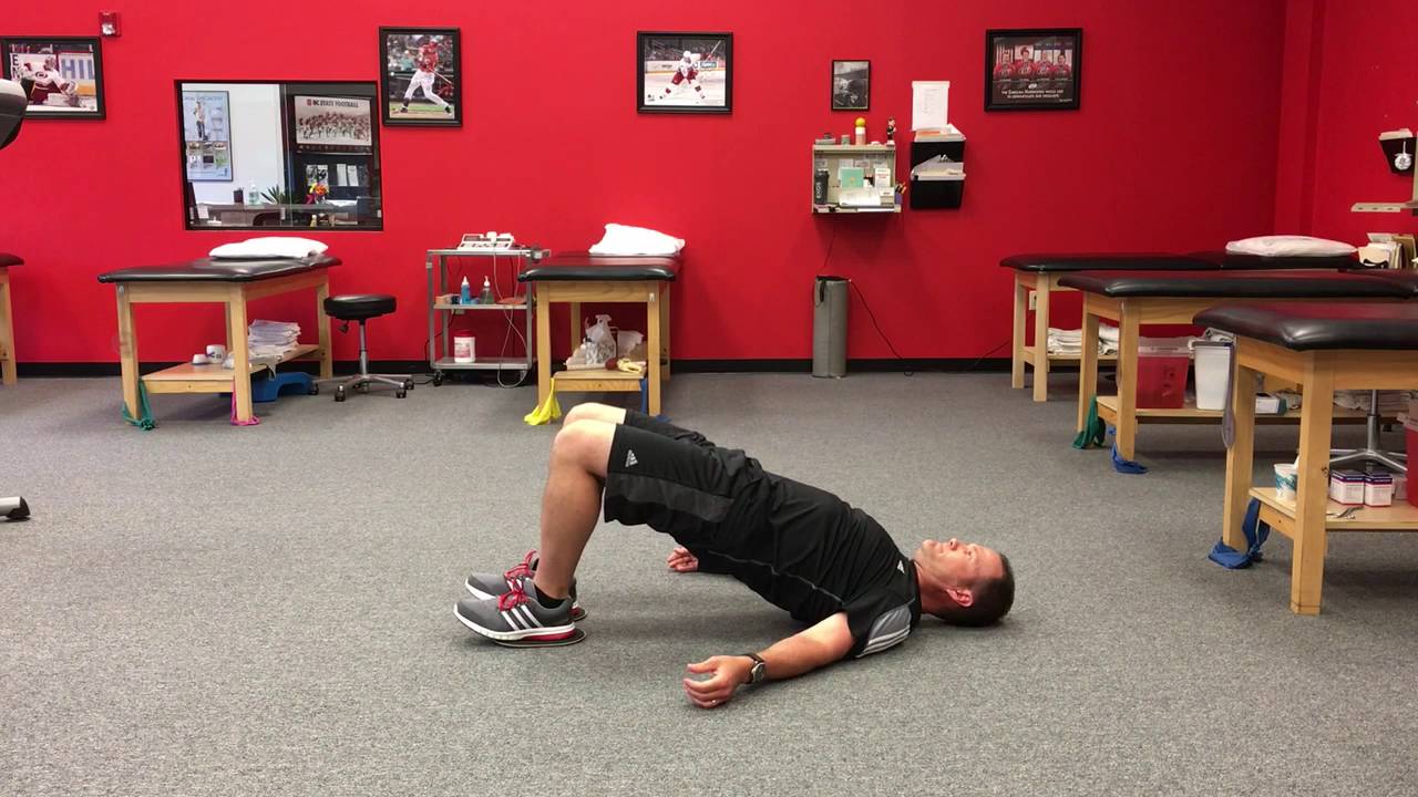 Supine reverse hamstring curl with gliding discs - YouTube