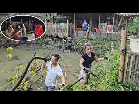 Hue and Dung cleaned the pond and caught fish to cook a meal with the children.