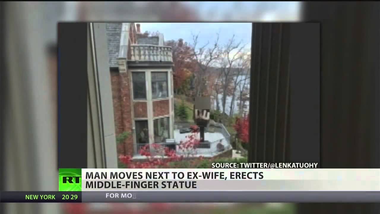 Man buys house next to ex wife, erects statue flicking her off - YouTube