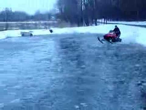snowmobile skipping water - YouTube