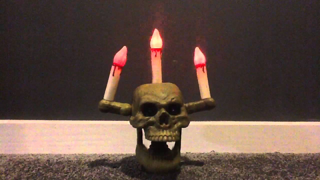 Singing skull with 3 candles - YouTube