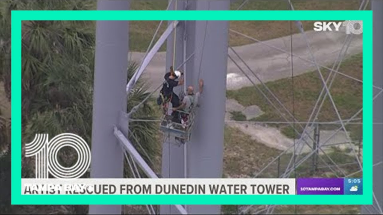 Rescuers save muralist from Dunedin water tower - YouTube