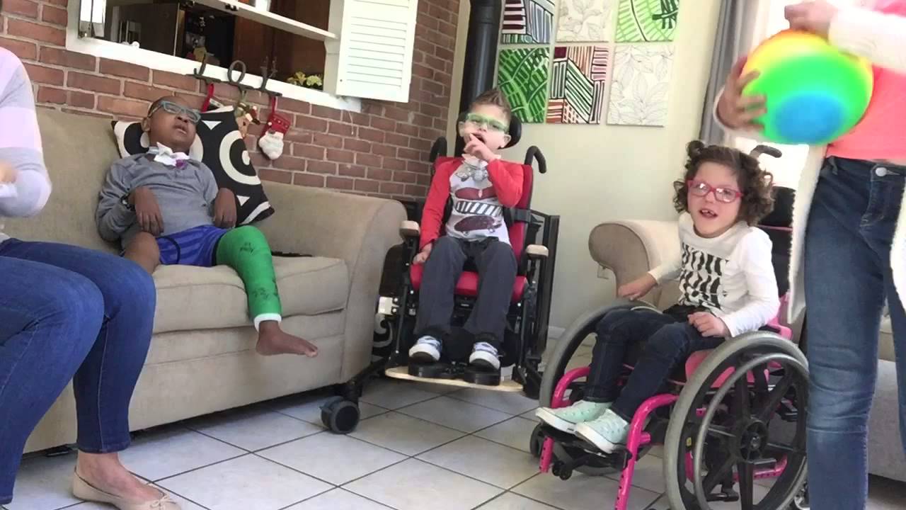 3 of our 6 kids playing ball and using PODD - YouTube