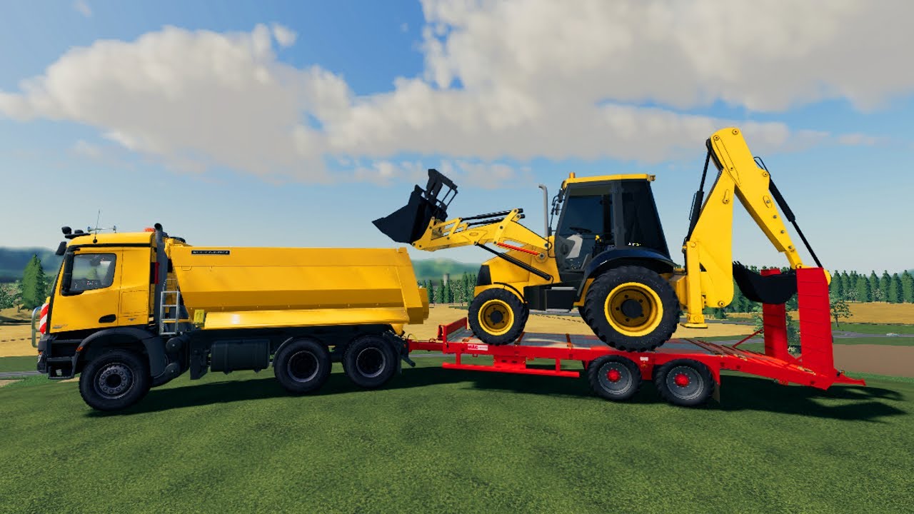 JCB Backhoe Loader transported on a trailer for construction works ...