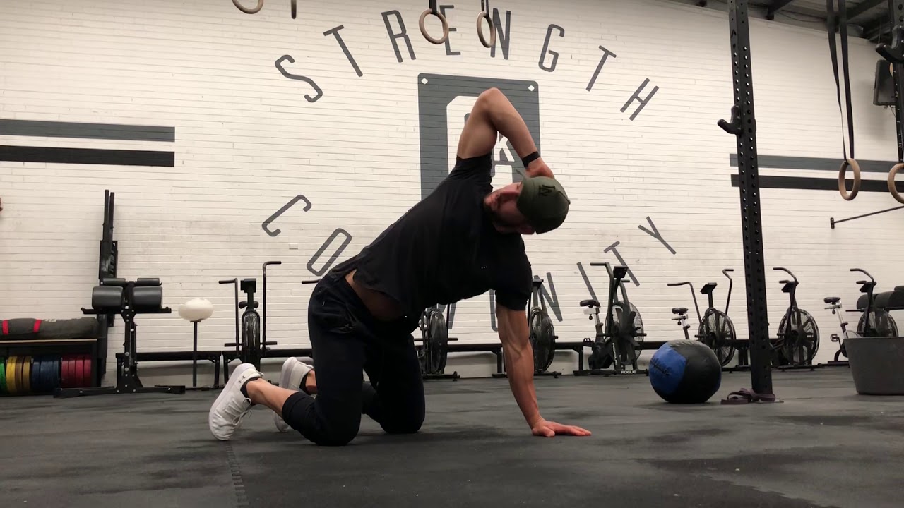 Quadruped thoracic rotation - YouTube