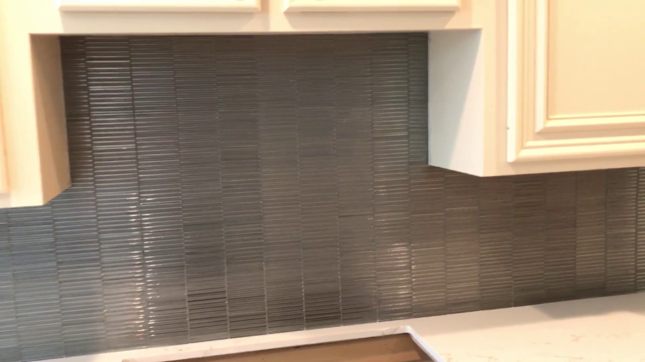 Another beautiful backsplash completed! We installed AKDO Loom Silver ...