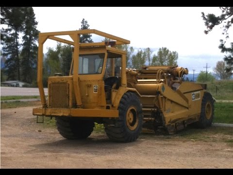 Caterpillar scraper 613B elevator stripping and stockpiling topsoil ...